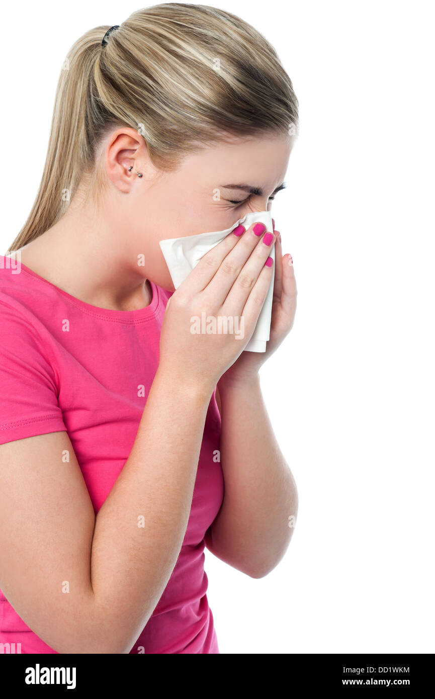 Girl covering her nose with handkerchief while sneezing Stock Photo - Alamy