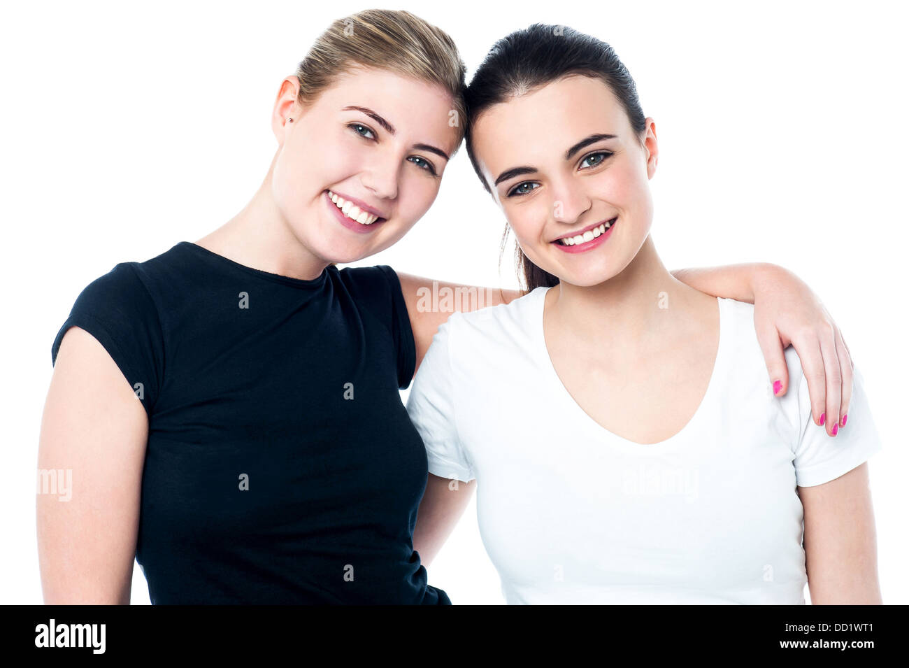 Charming young girls wearing a bright smile on their faces Stock Photo ...