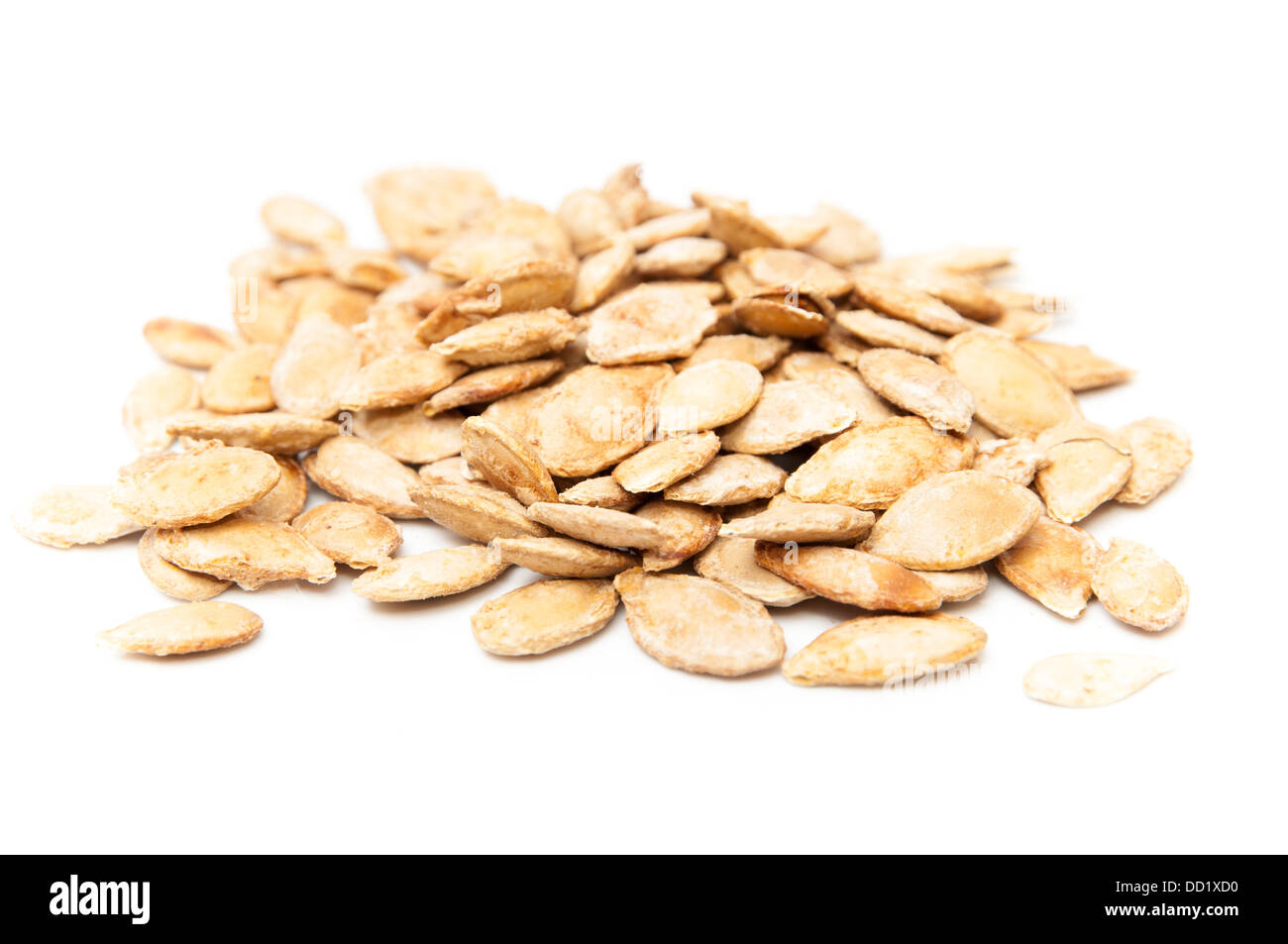 pumpkin seeds on a white background Stock Photo - Alamy