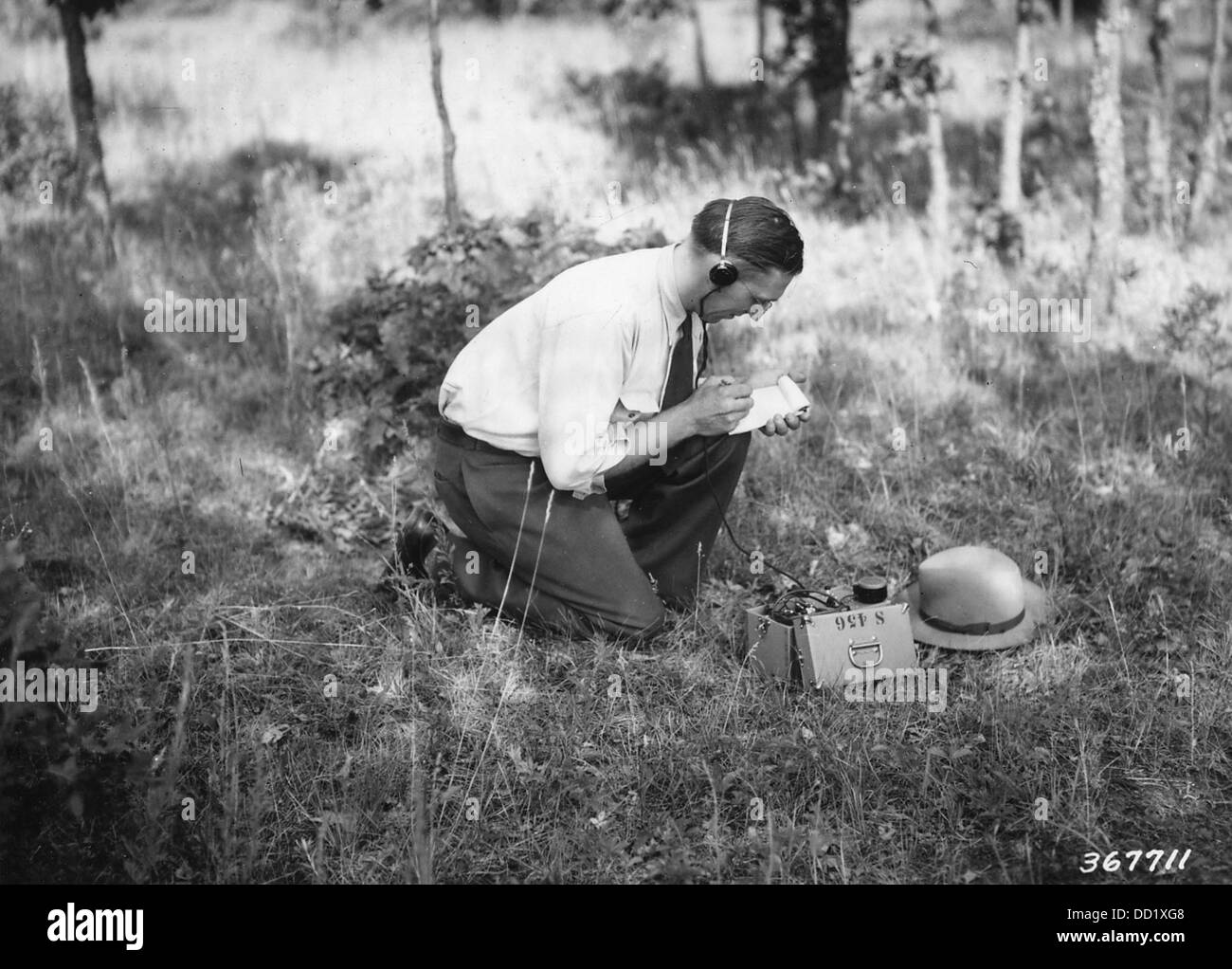 This image shows the use of radio communication to direct fire ...