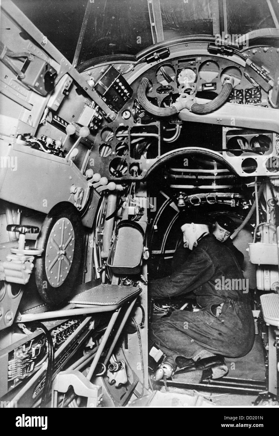 The image from the Nazi Propaganda! shows an aircraft mechanic working ...