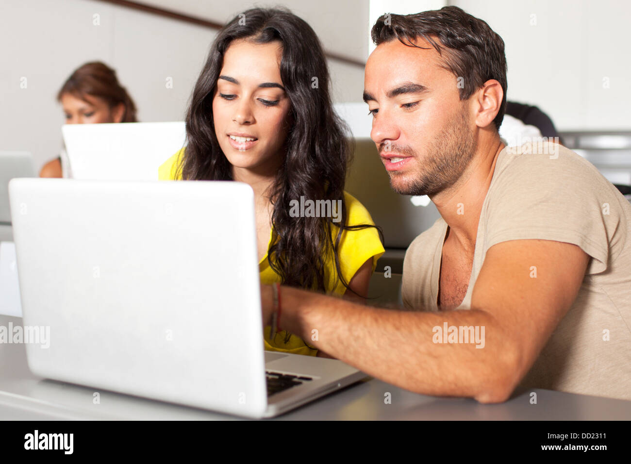 Two students talking in the classroom Stock Photo - Alamy