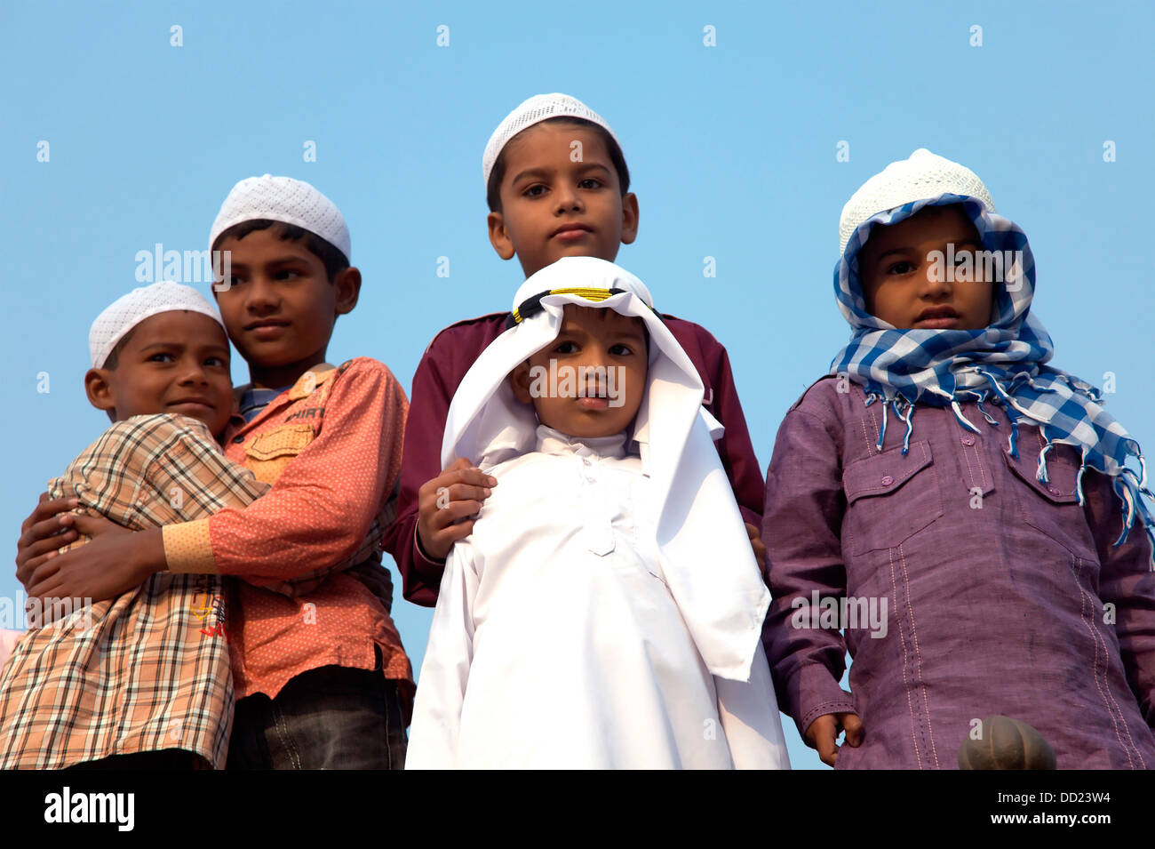 Children hug each other after the morning prayers at the historic Jama ...