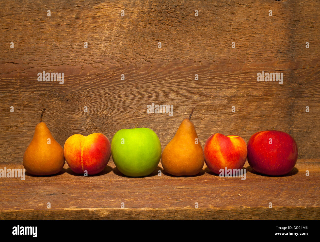 Variety Of Fruit In A Row On A Wooden Shelf; Waterloo, Quebec, Canada ...