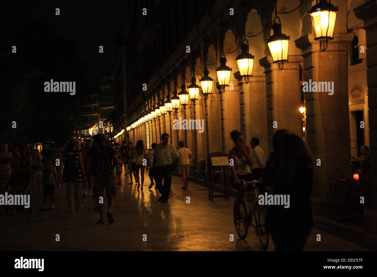 People strolling at night beside the Liston in Corfu Town in Greece ...