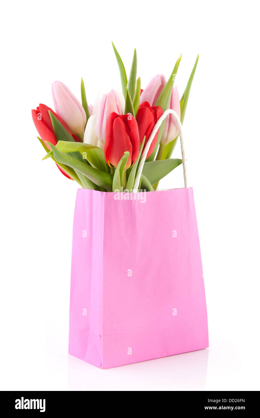 Pink shopping bag with tulips Stock Photo - Alamy