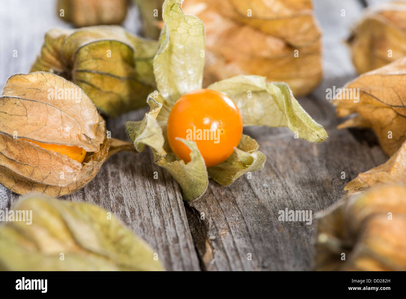 Fresh Physalis Fruits on vintage wooden background Stock Photo - Alamy
