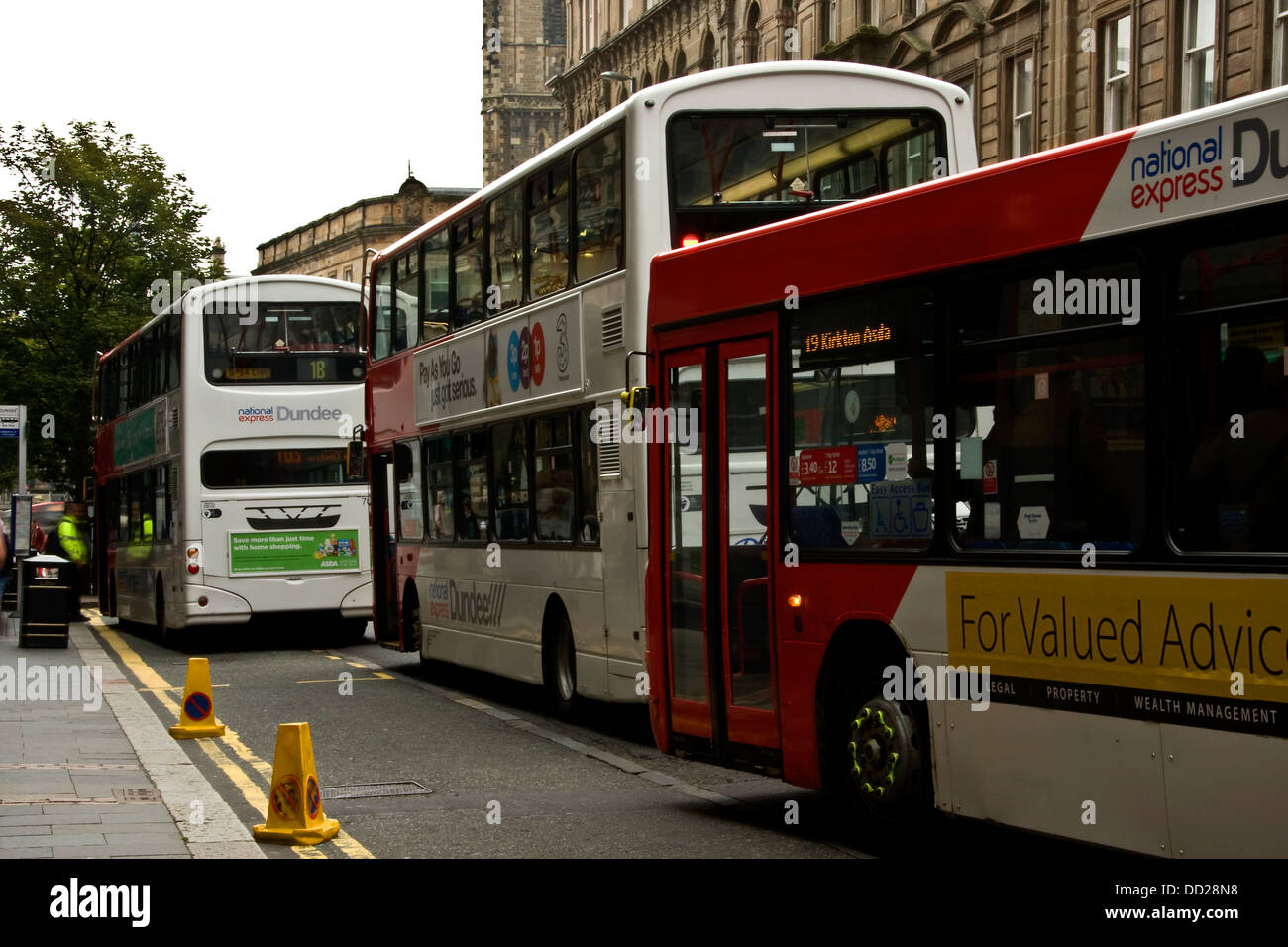 Three National Express buses parking along Commercial Street to collect ...