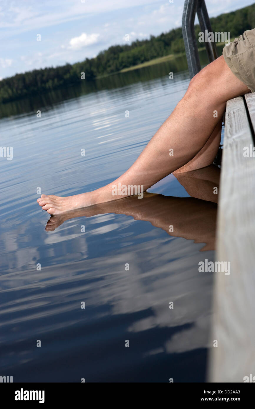 Feet in water Stock Photo - Alamy