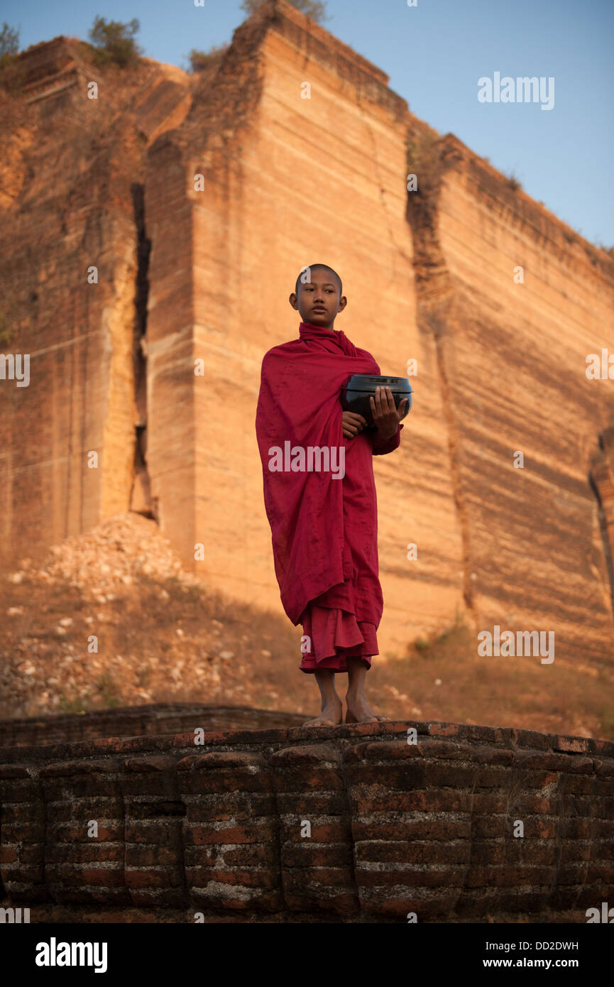 Young monk standing in front of temple in Mingun Burma Myanmar Stock ...