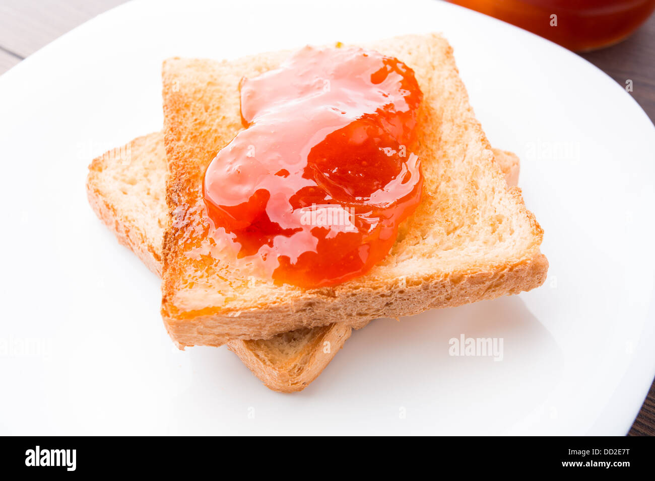 Toast with jam on a plate Stock Photo - Alamy