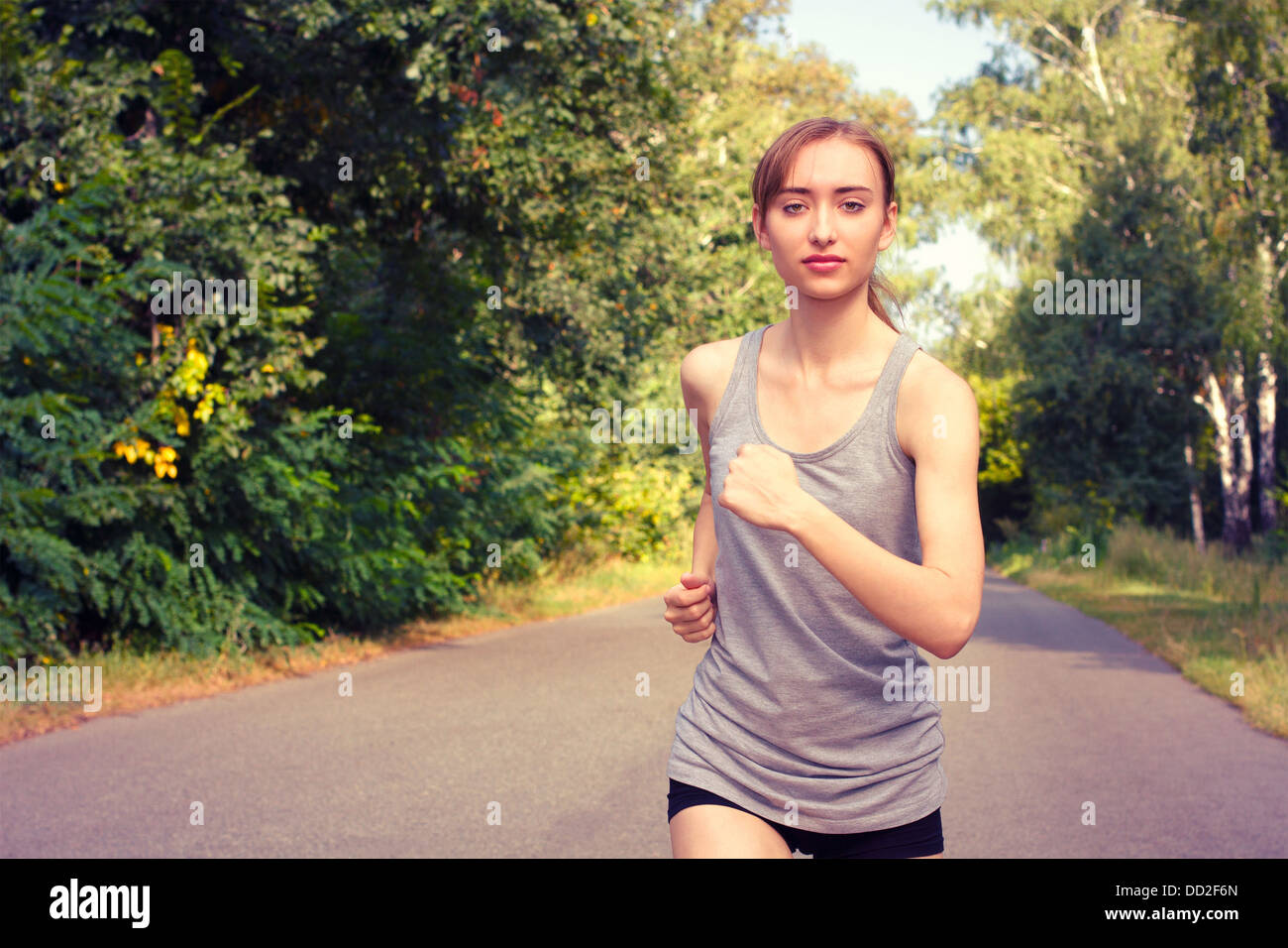 runner - woman running outdoors training for marathon run beautiful ...