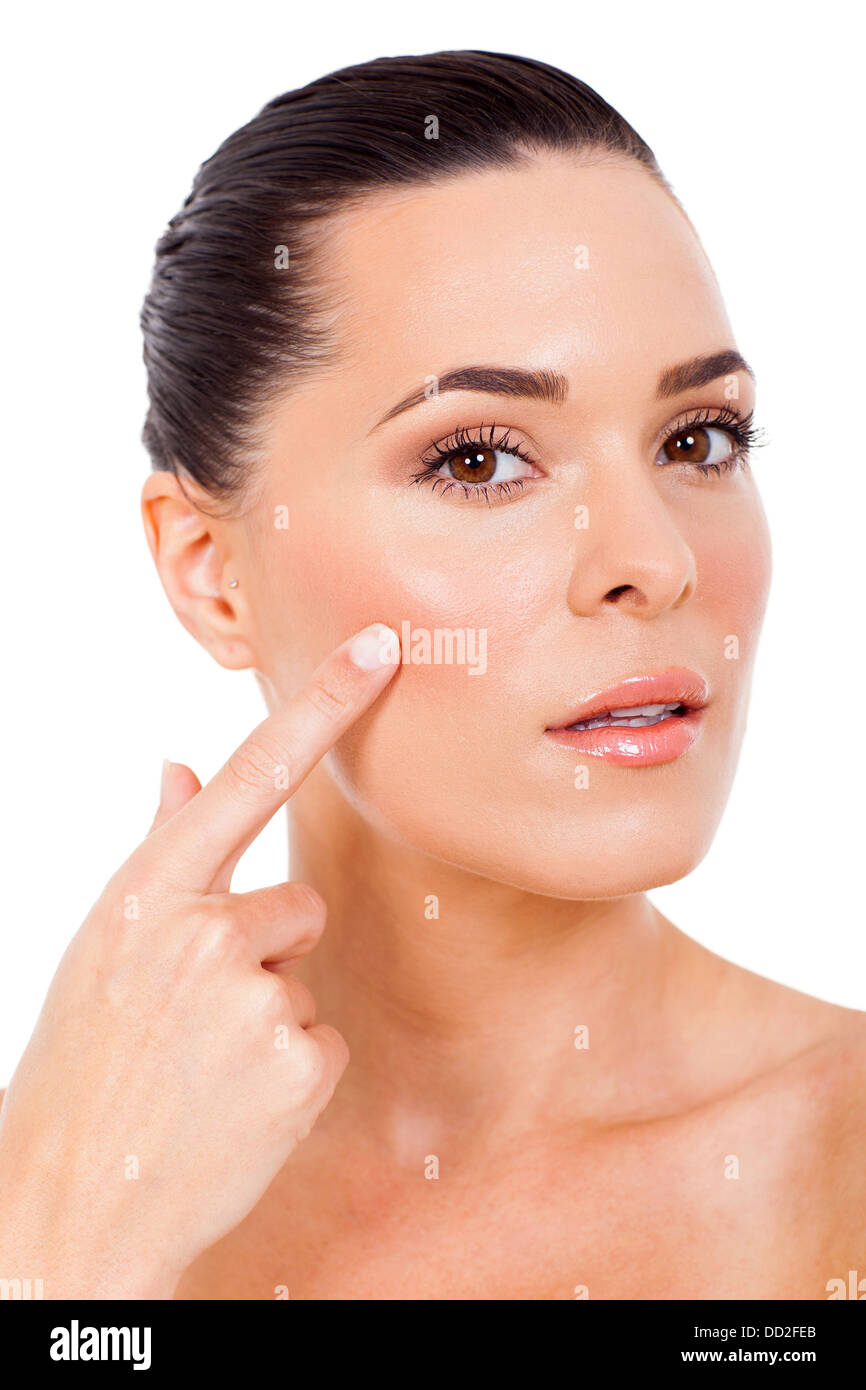 beautiful woman pointing her cheek isolated on white background Stock ...