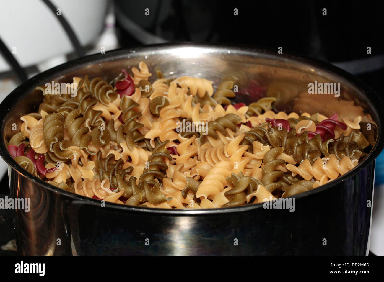 Spiral pasta cooking in a pot Stock Photo - Alamy