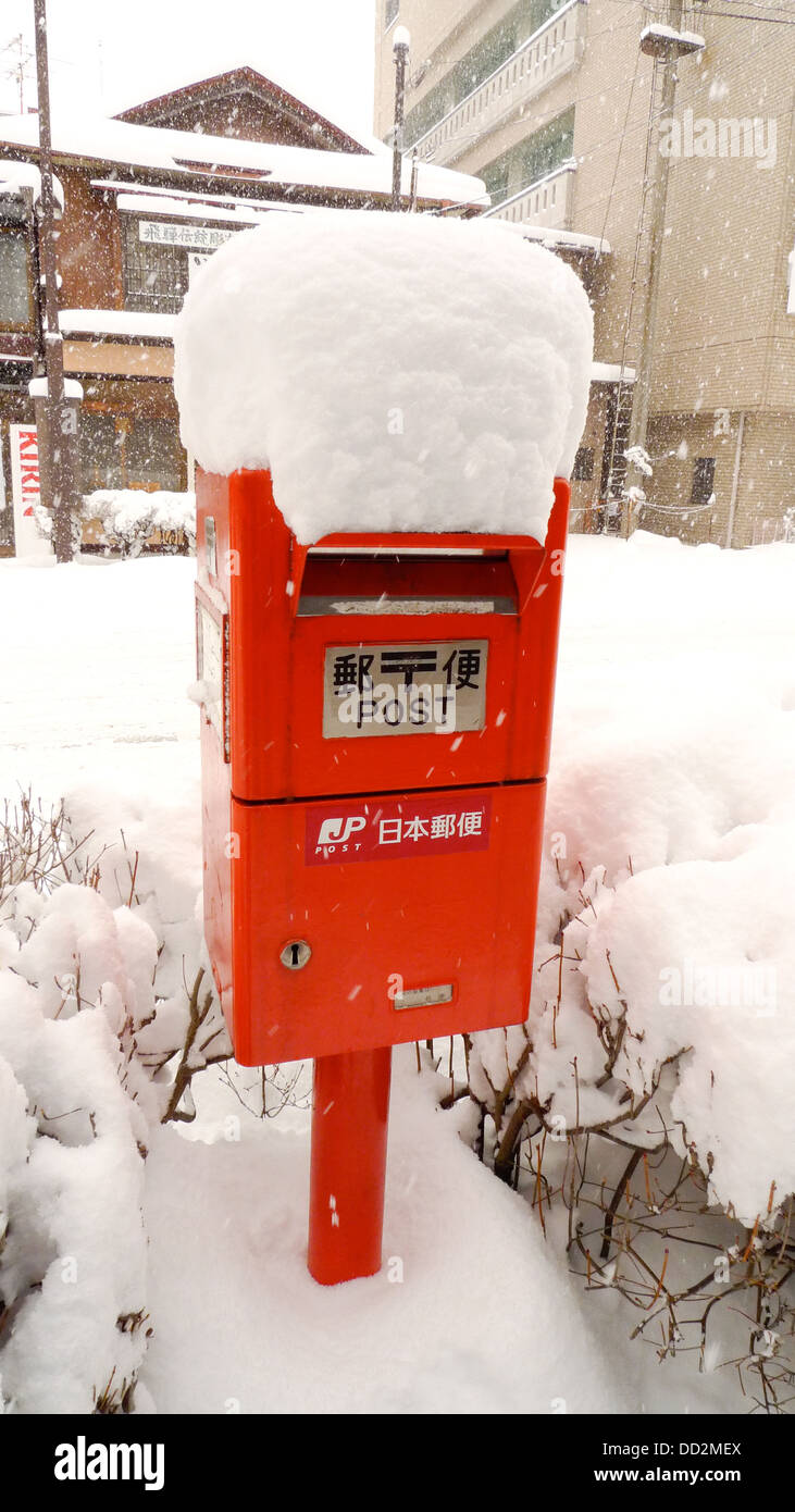 A Japanese post box with snow on the top Stock Photo - Alamy