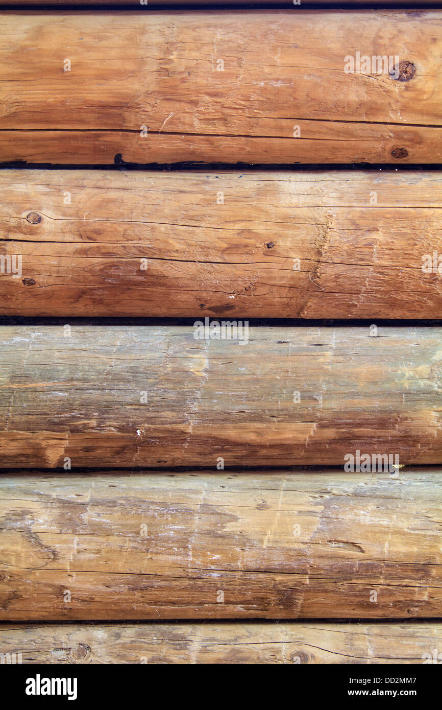 Close up of five logs that are part of a traditional log cabin wall ...