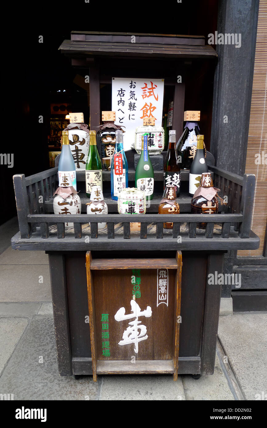 A display of sake bottles outside a shop in Takayama in Gifu Prefecture ...