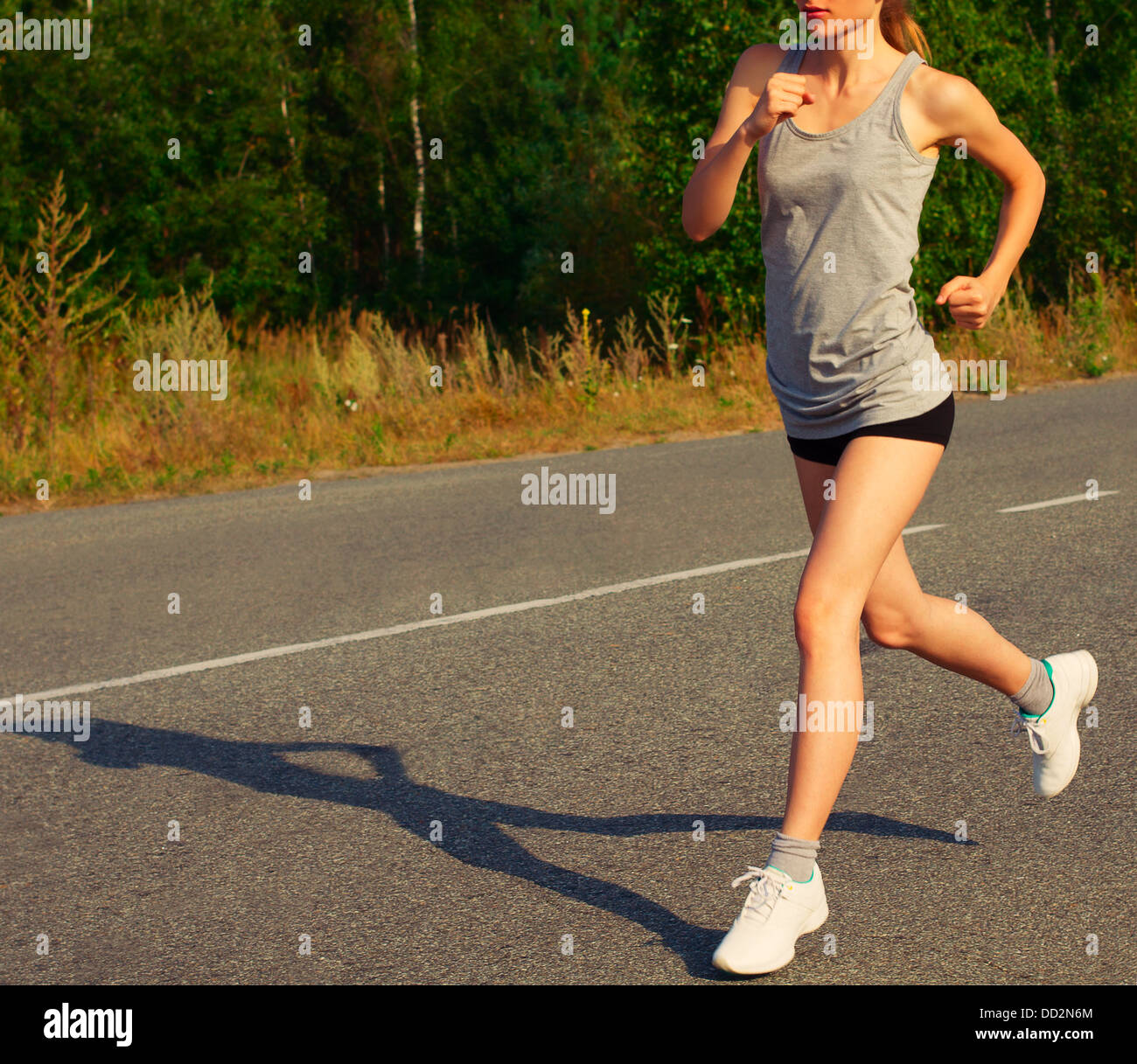 runner - woman running outdoors training for marathon run beautiful ...