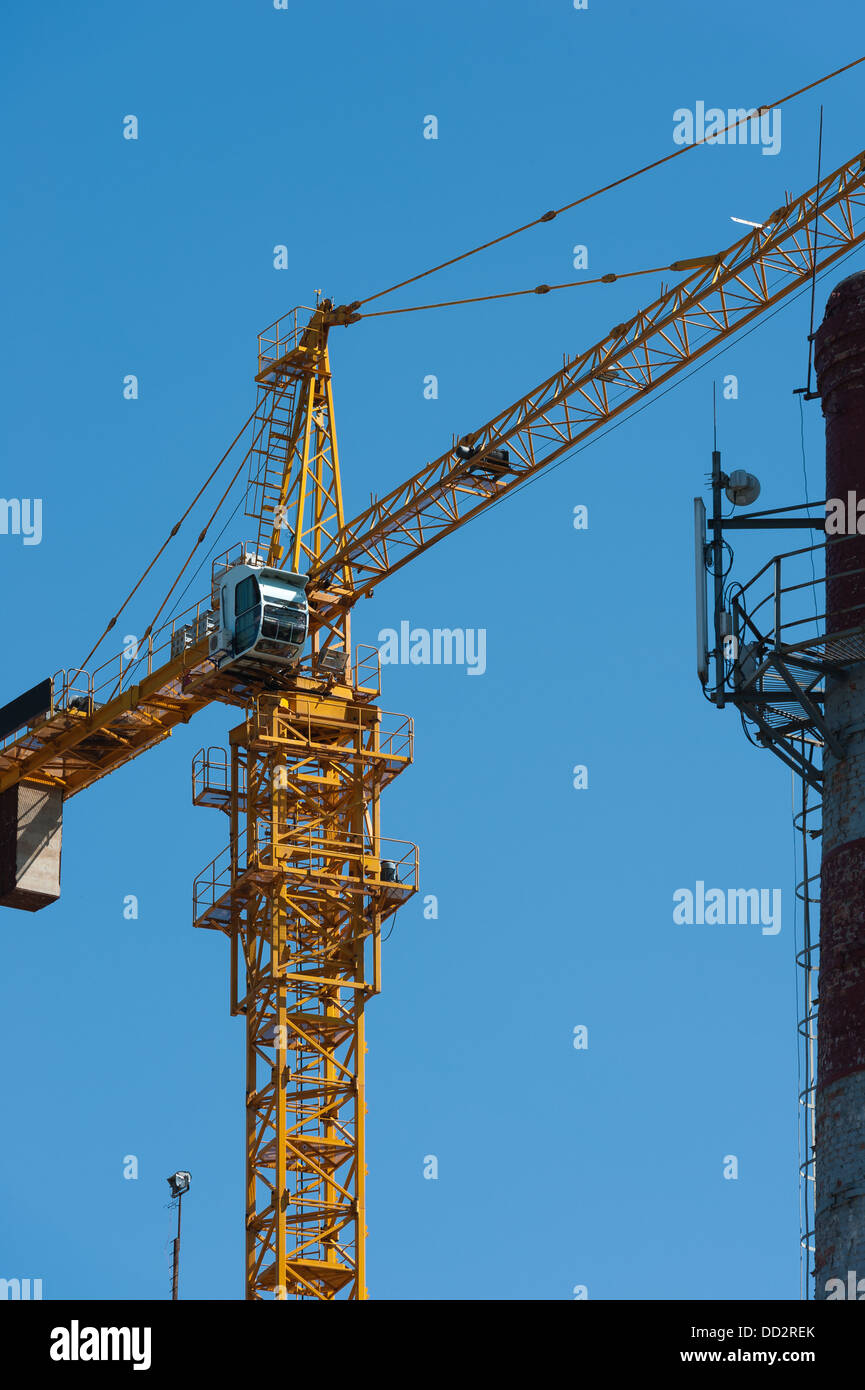 Yellow and blue tower crane hi-res stock photography and images - Alamy