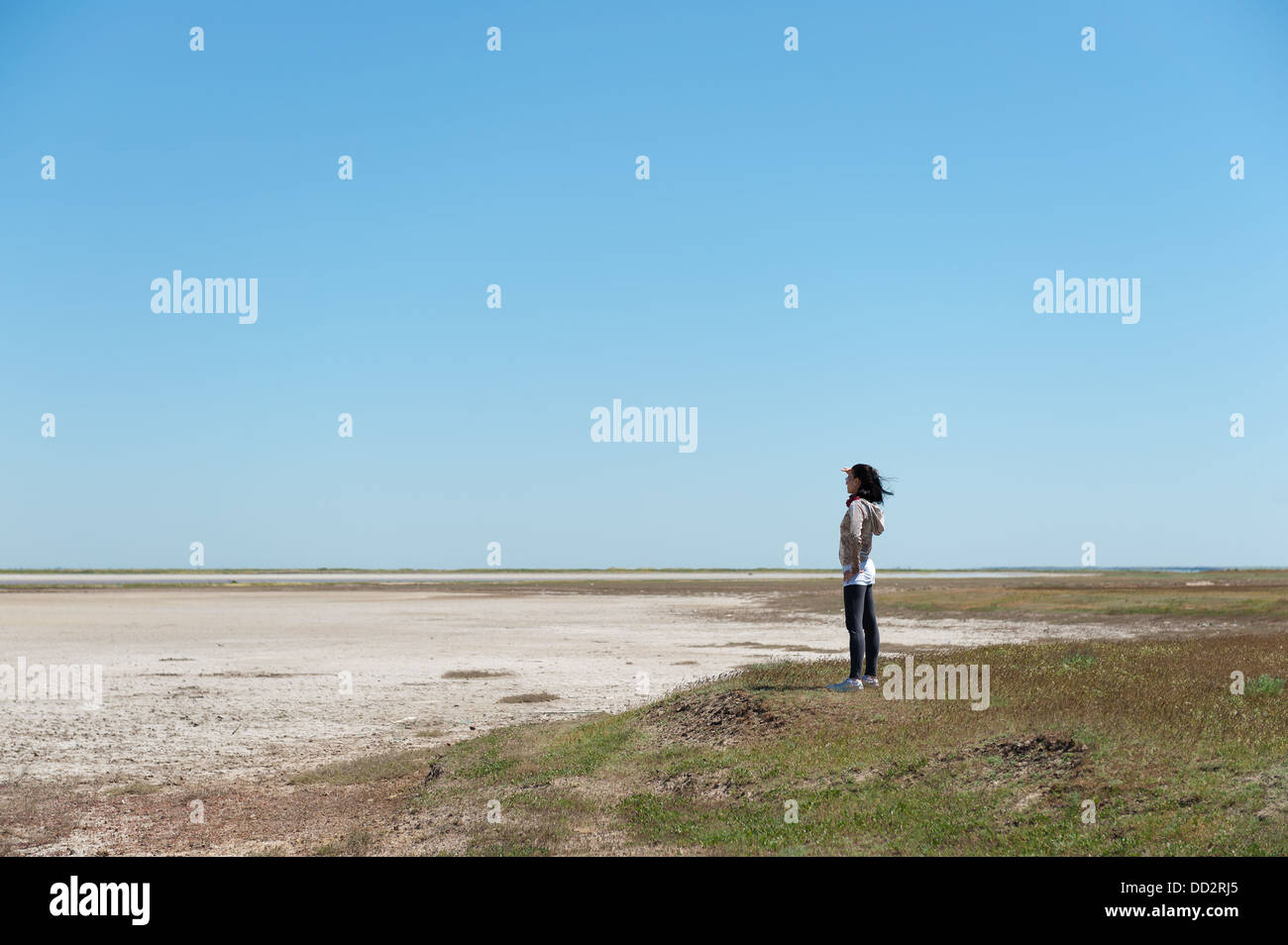 Girl at the edge of desert Stock Photo - Alamy