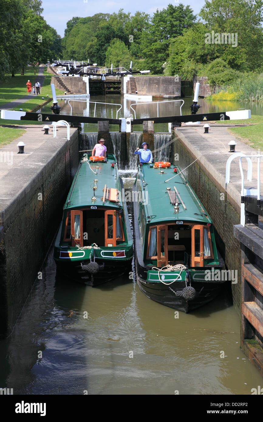 Two narrowboats descending in double lock no. 43 of the Hatton Locks ...
