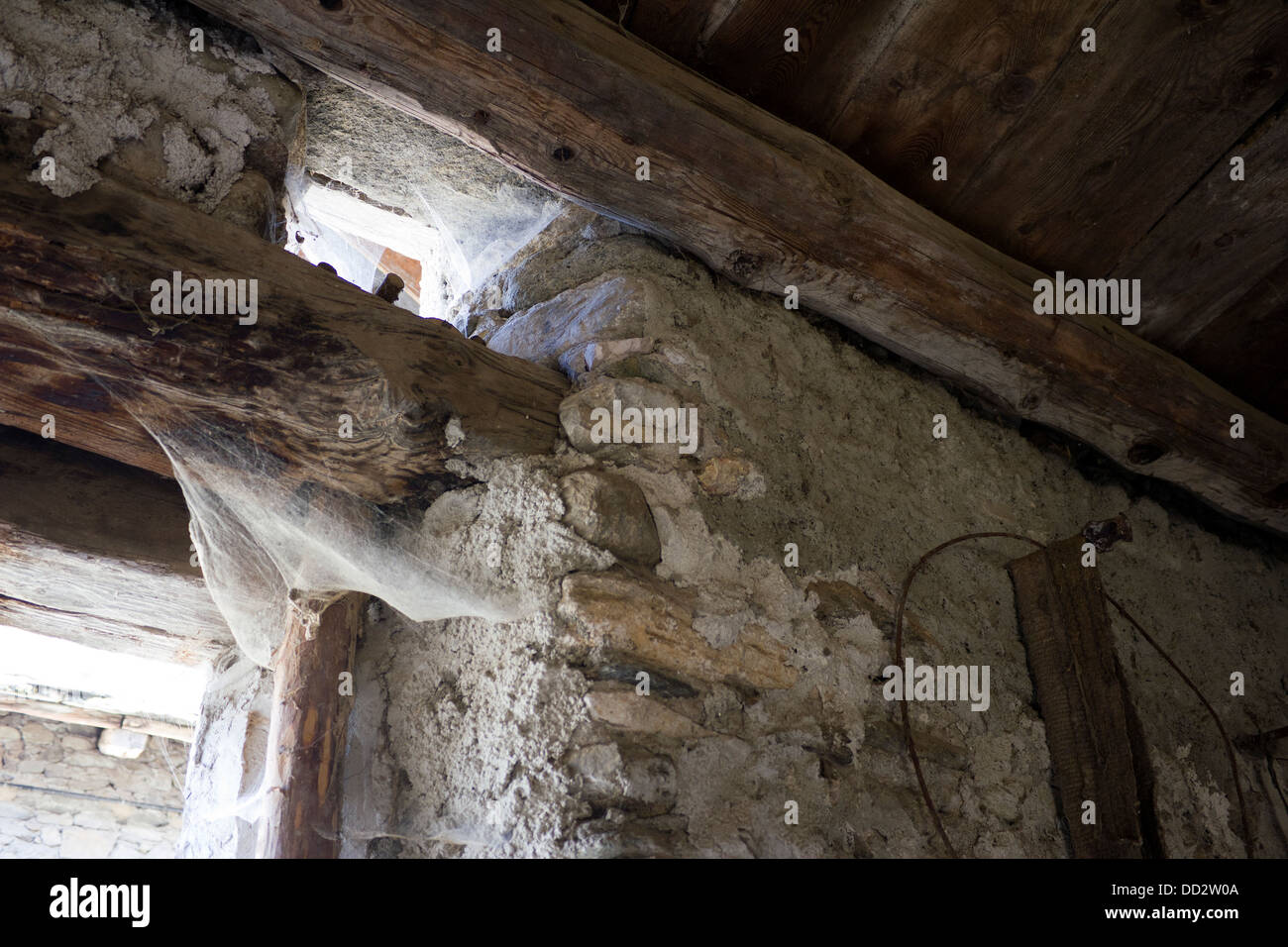 Cobwebs in the light (from inside an old stable in the Alps Stock Photo ...
