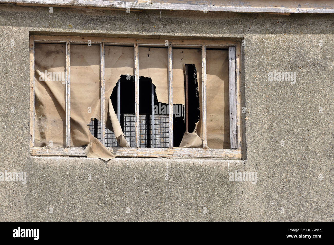 Barred window with torn shield shielding Stock Photo - Alamy