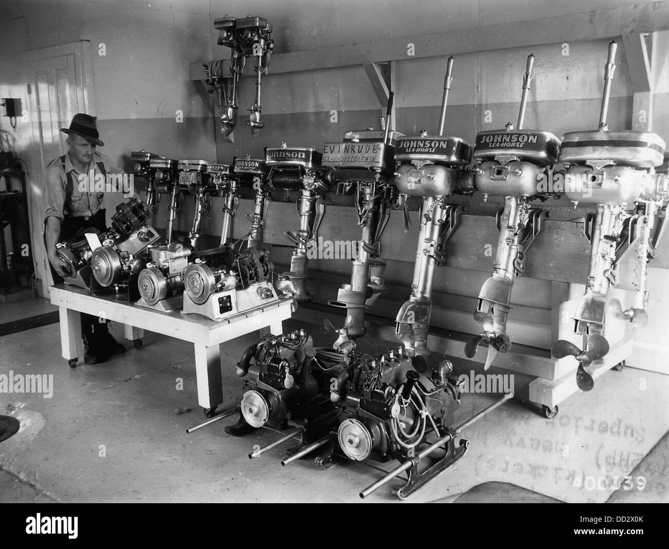 This photograph shows outboard motors and fire pumpers, which are part ...