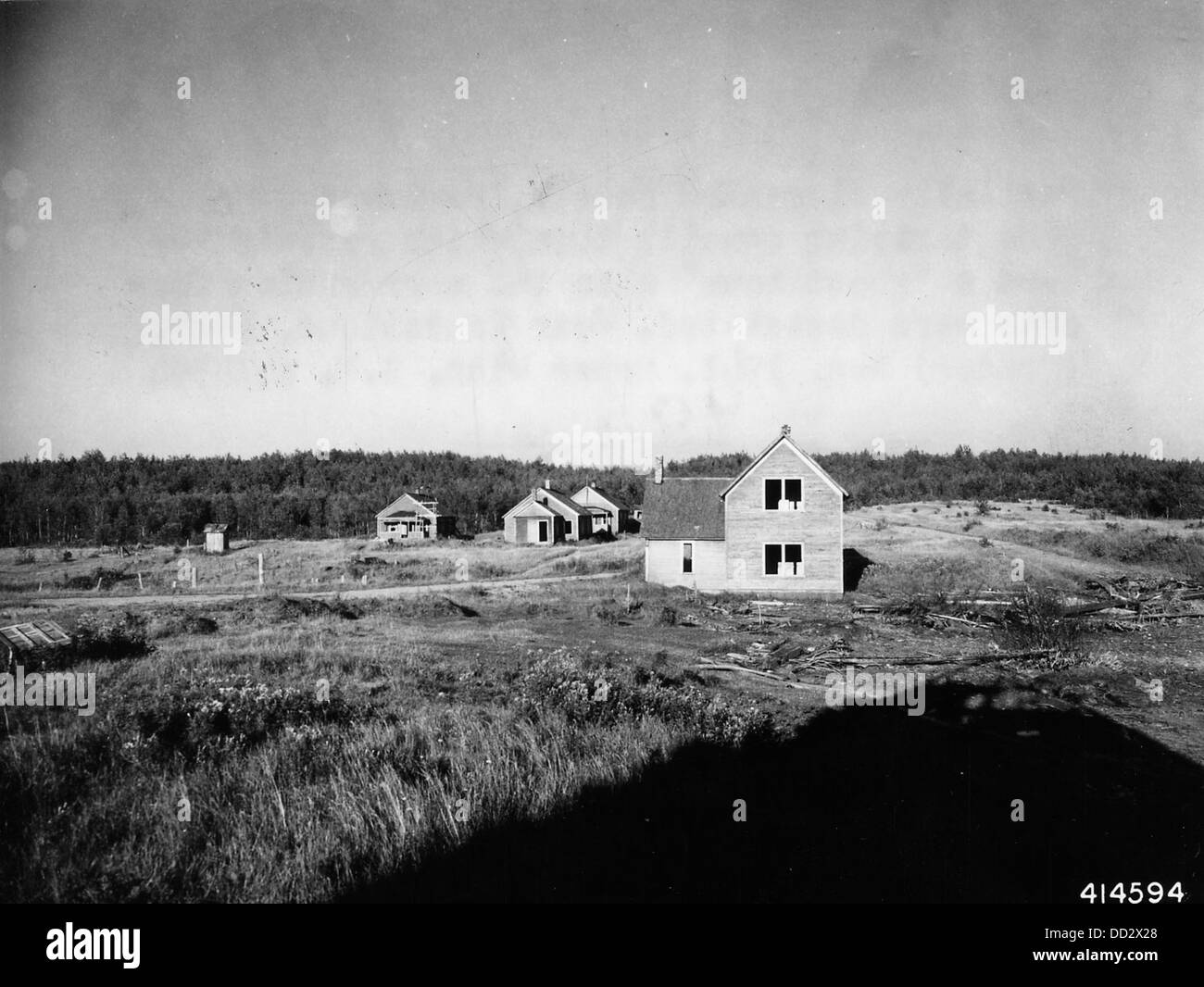 The image depicts partially dismantled houses, which could suggest ...