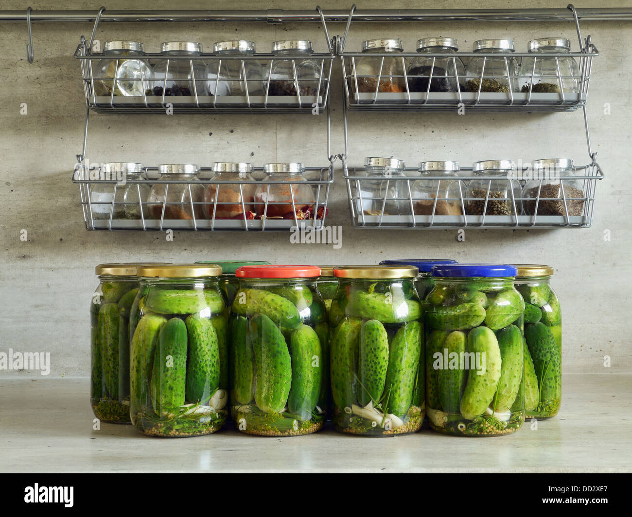 Pickled green cucumbers on kitchen countertop Stock Photo - Alamy