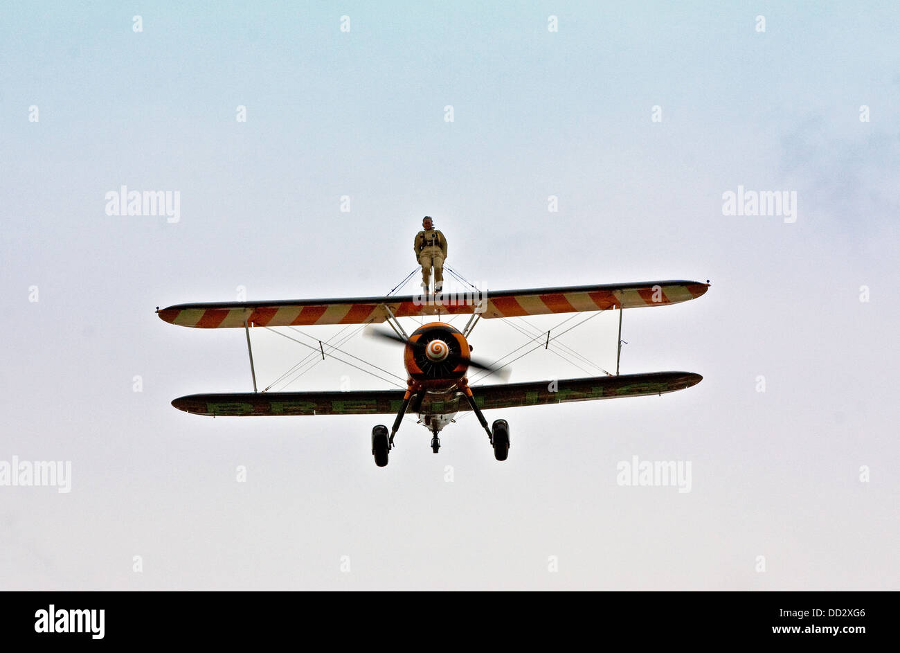 Female wing walker on top of a biplane Stock Photo - Alamy