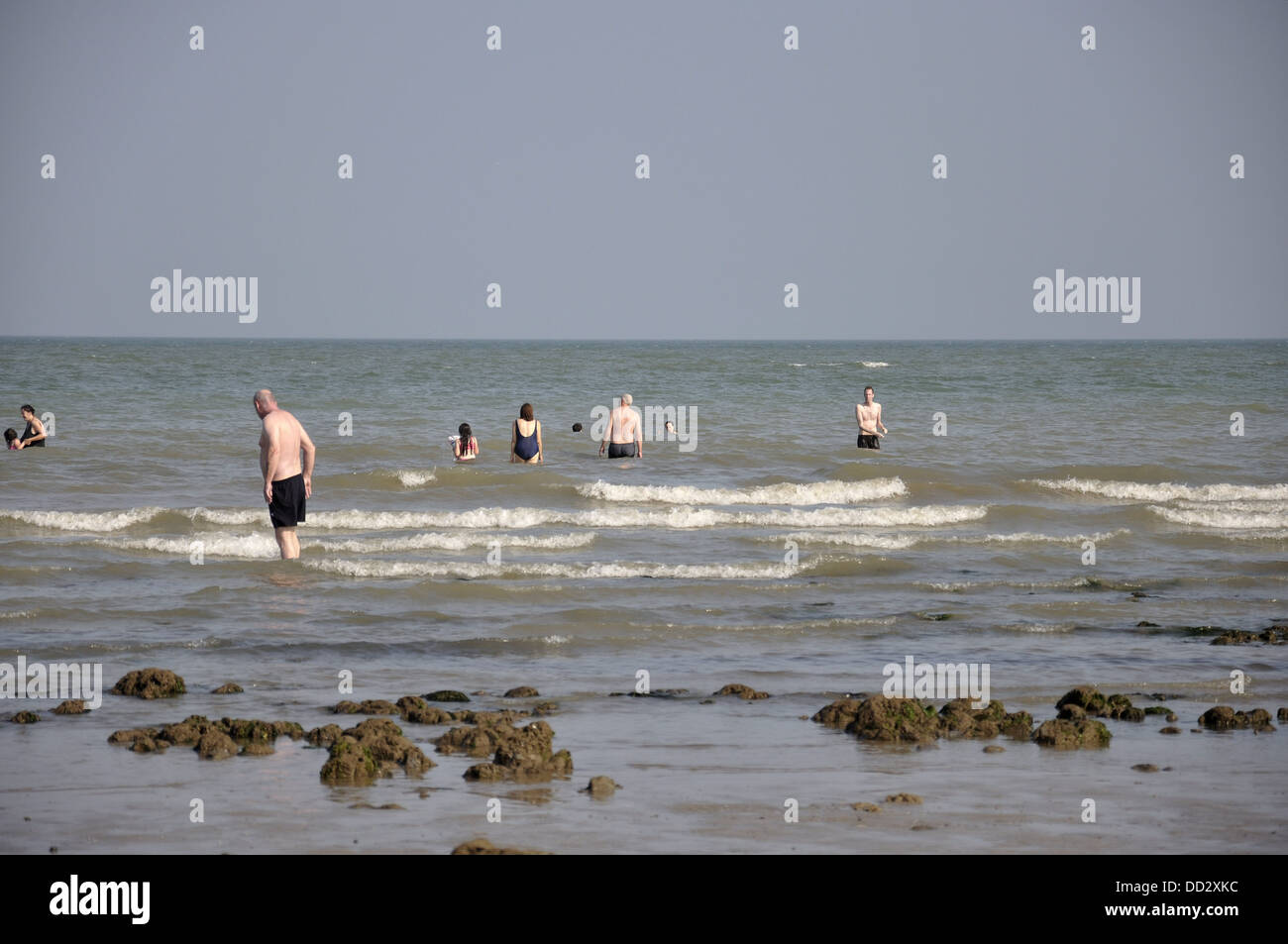 People wading in sea off Eastbourne beach Stock Photo - Alamy