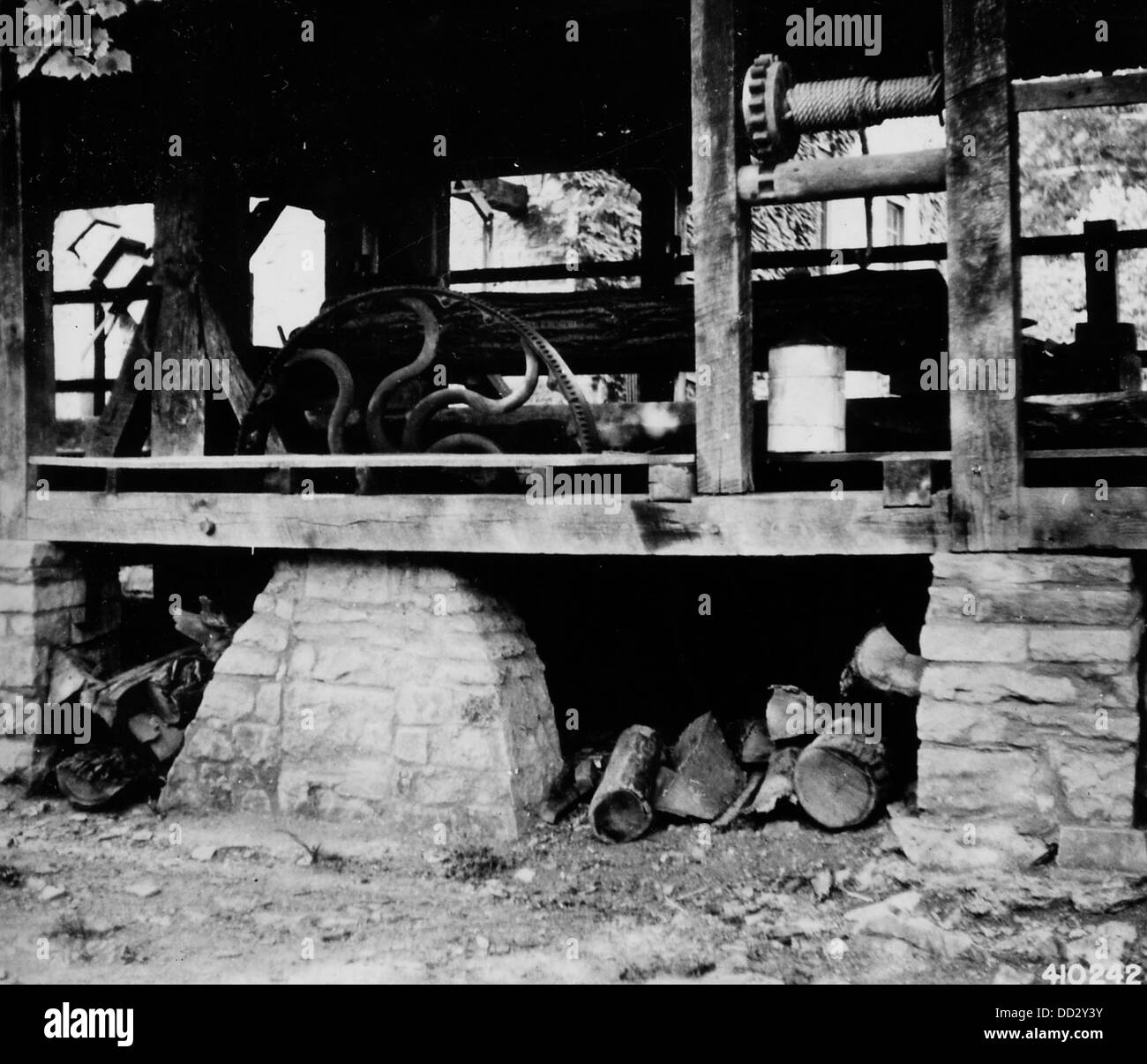 A traditional sawmill powered by water, used for cutting wood at a ...