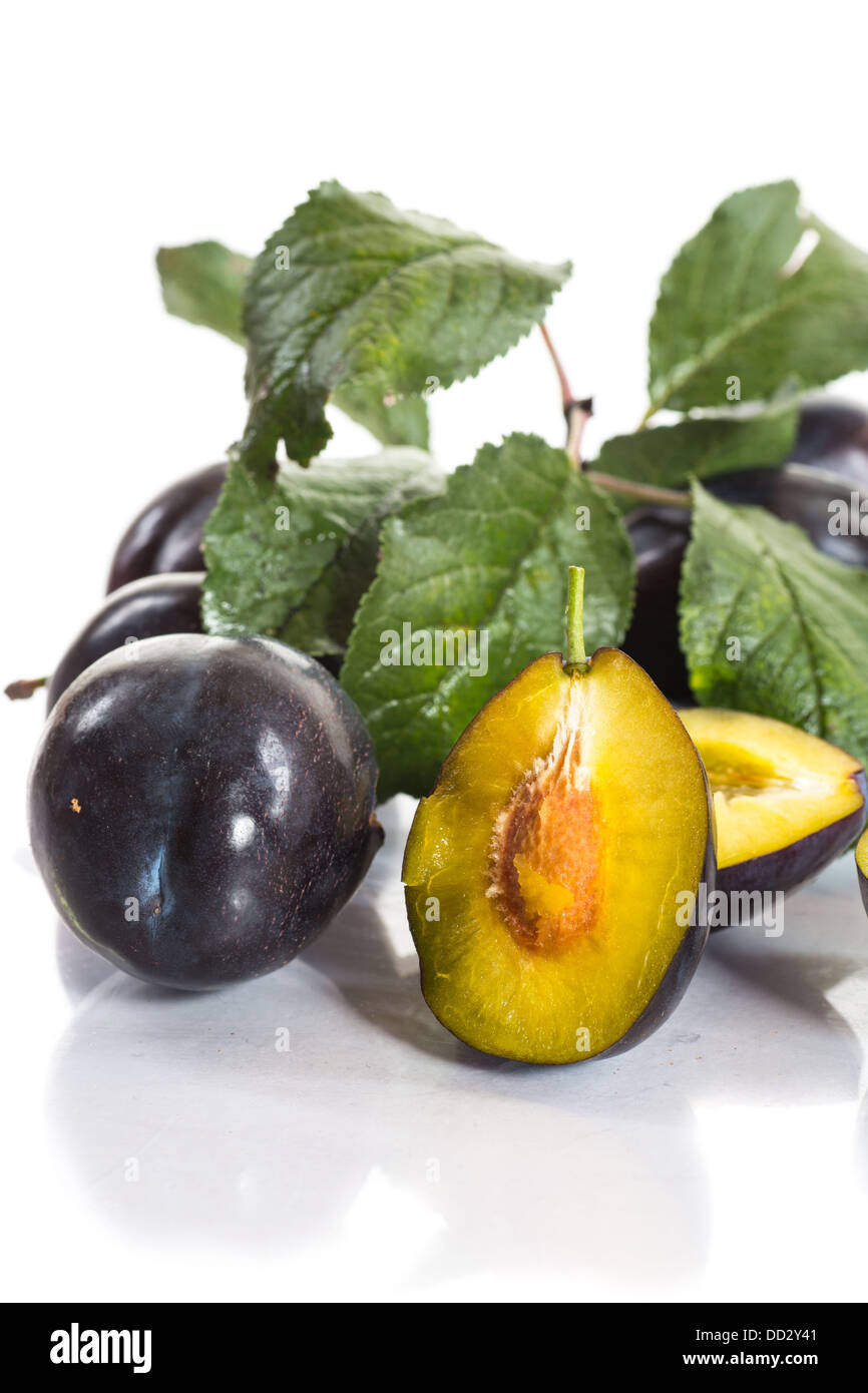 ripe plums isolated on a white background Stock Photo - Alamy