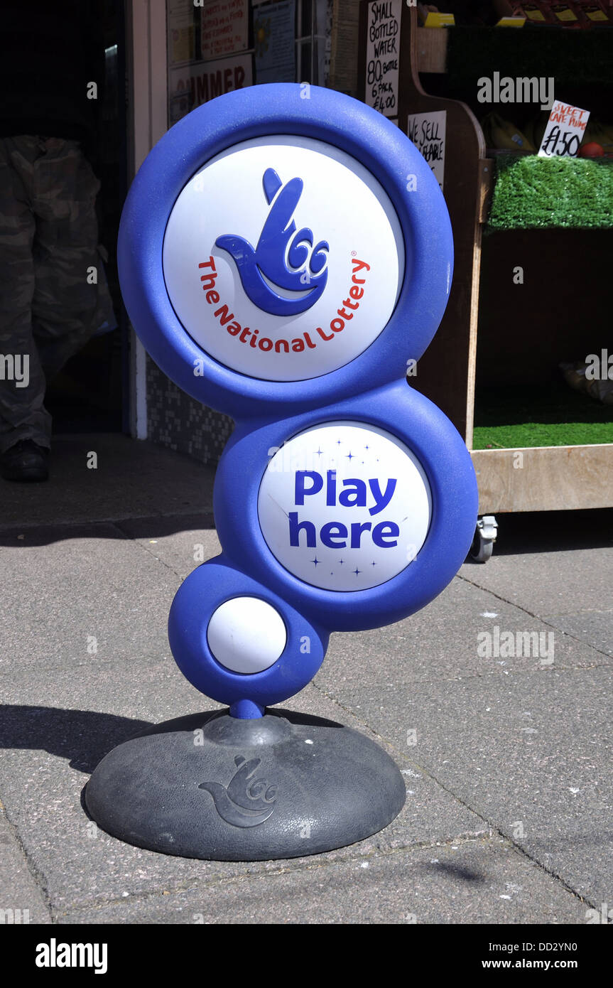 National Lottery sign on pavement outside shop Stock Photo - Alamy