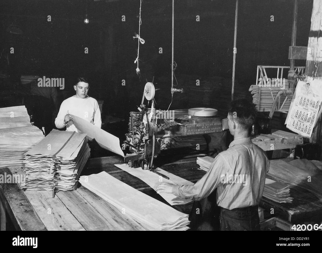 A photograph of small pieces of veneer taped together, likely used for ...