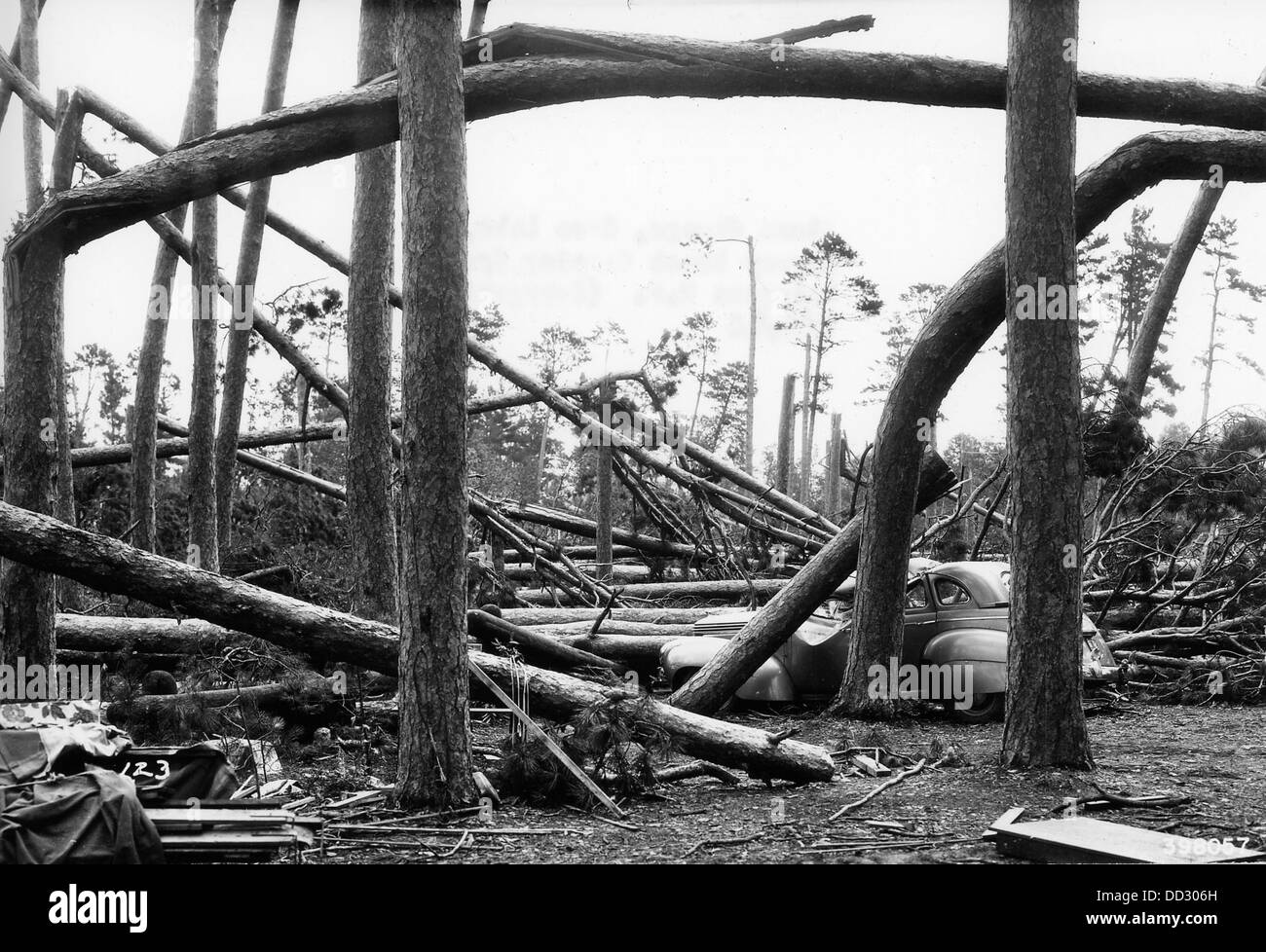 This image depicts the aftermath of a storm, showing significant damage ...