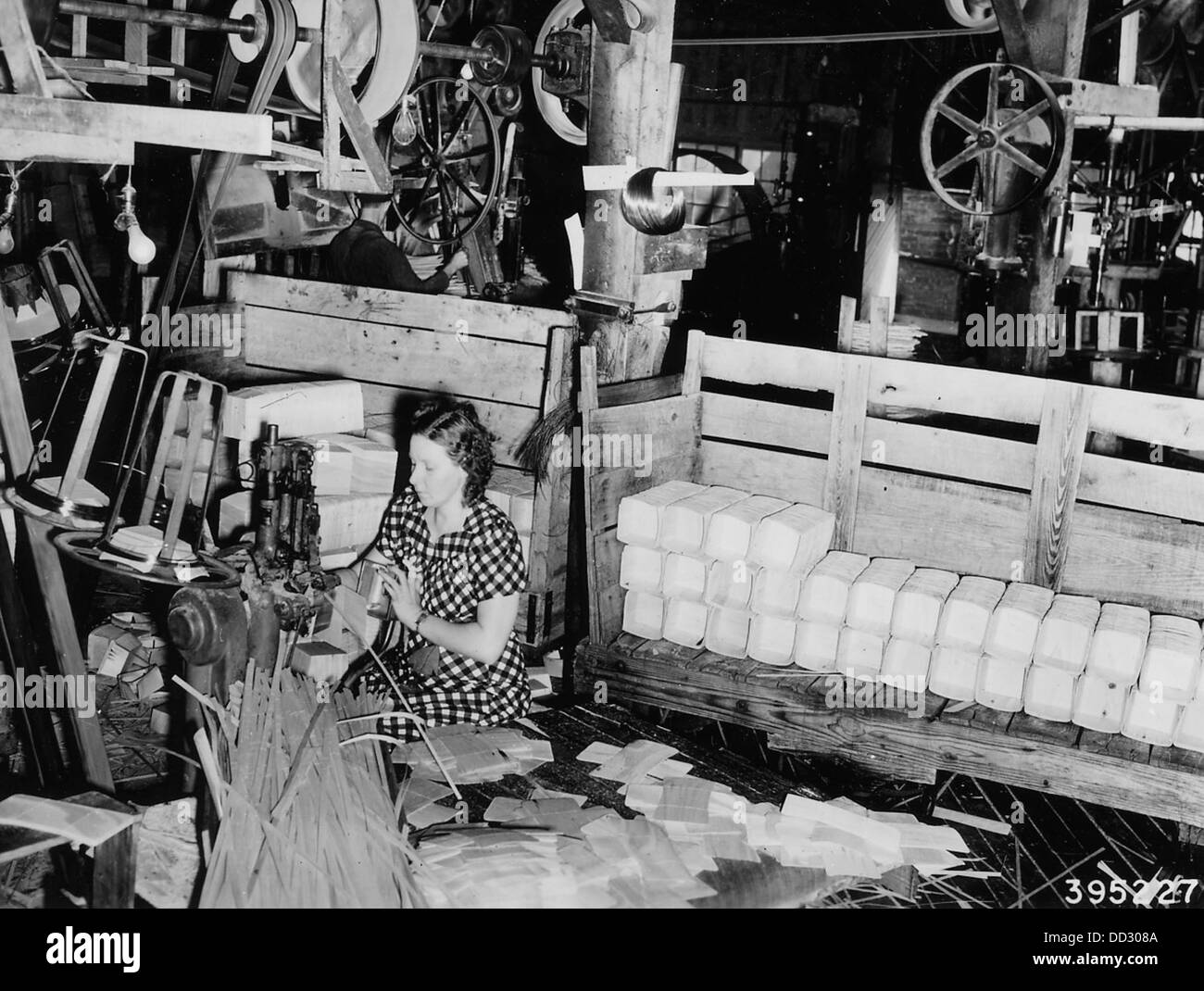 Strawberry baskets are assembled, reflecting the agricultural process ...