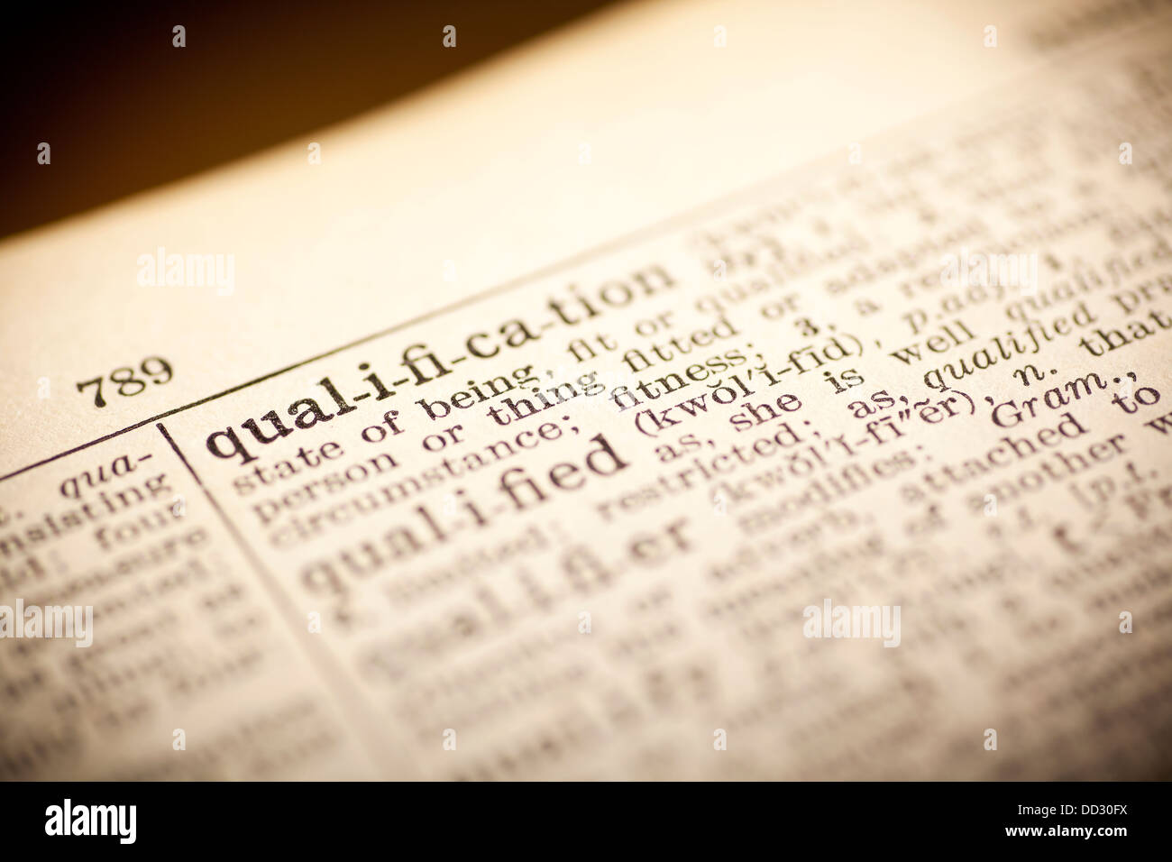 Dictionary word qualification Stock Photo - Alamy