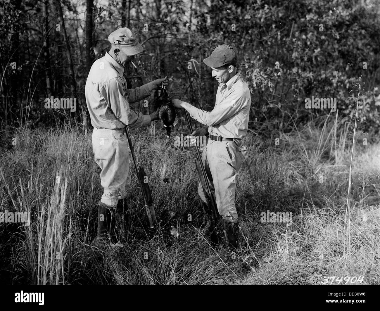 Two hunters Black and White Stock Photos & Images - Alamy
