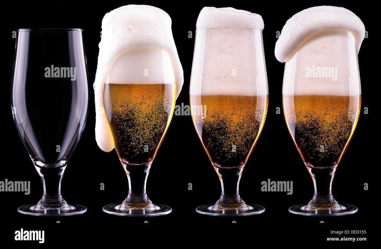 full and empty glass of light beer isolated on a black background Stock ...