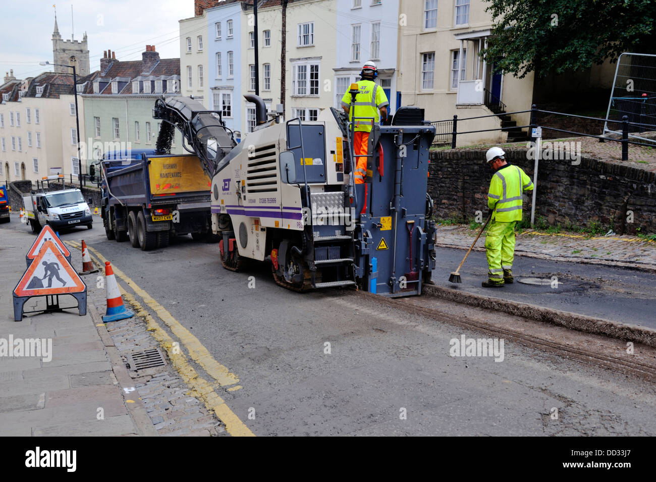 An asphalt planning machine in use to remove the road surface before ...