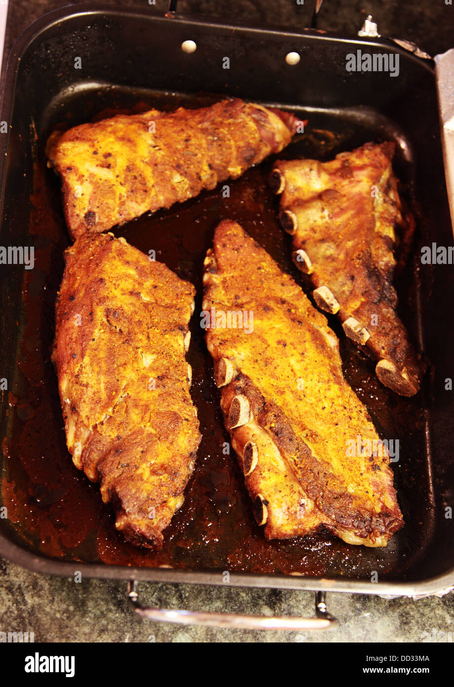 Dry rub on rack of ribs slow cooked in an oven Stock Photo - Alamy