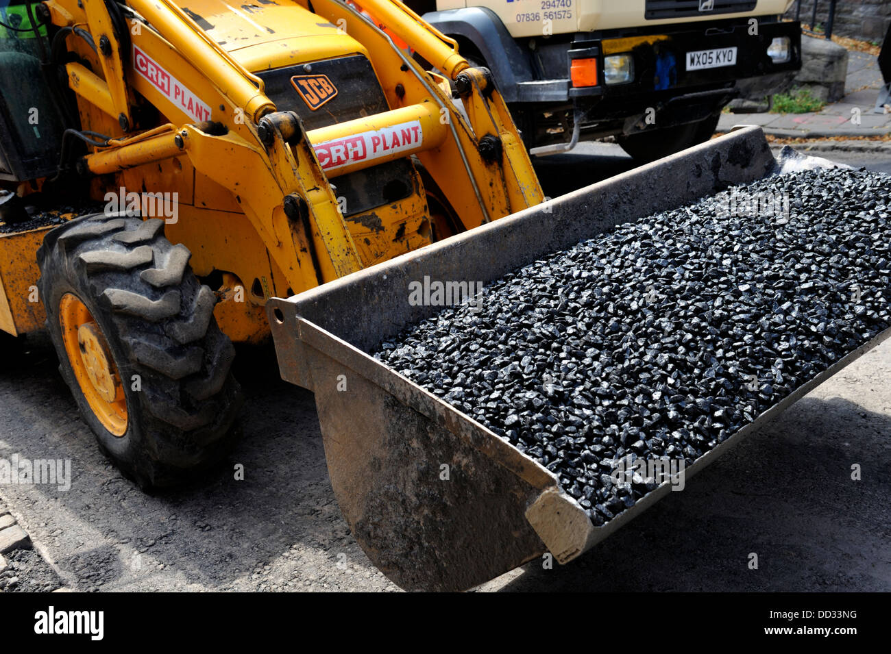 Bucket of wheeled loader filled with asphalt for road repair Stock ...
