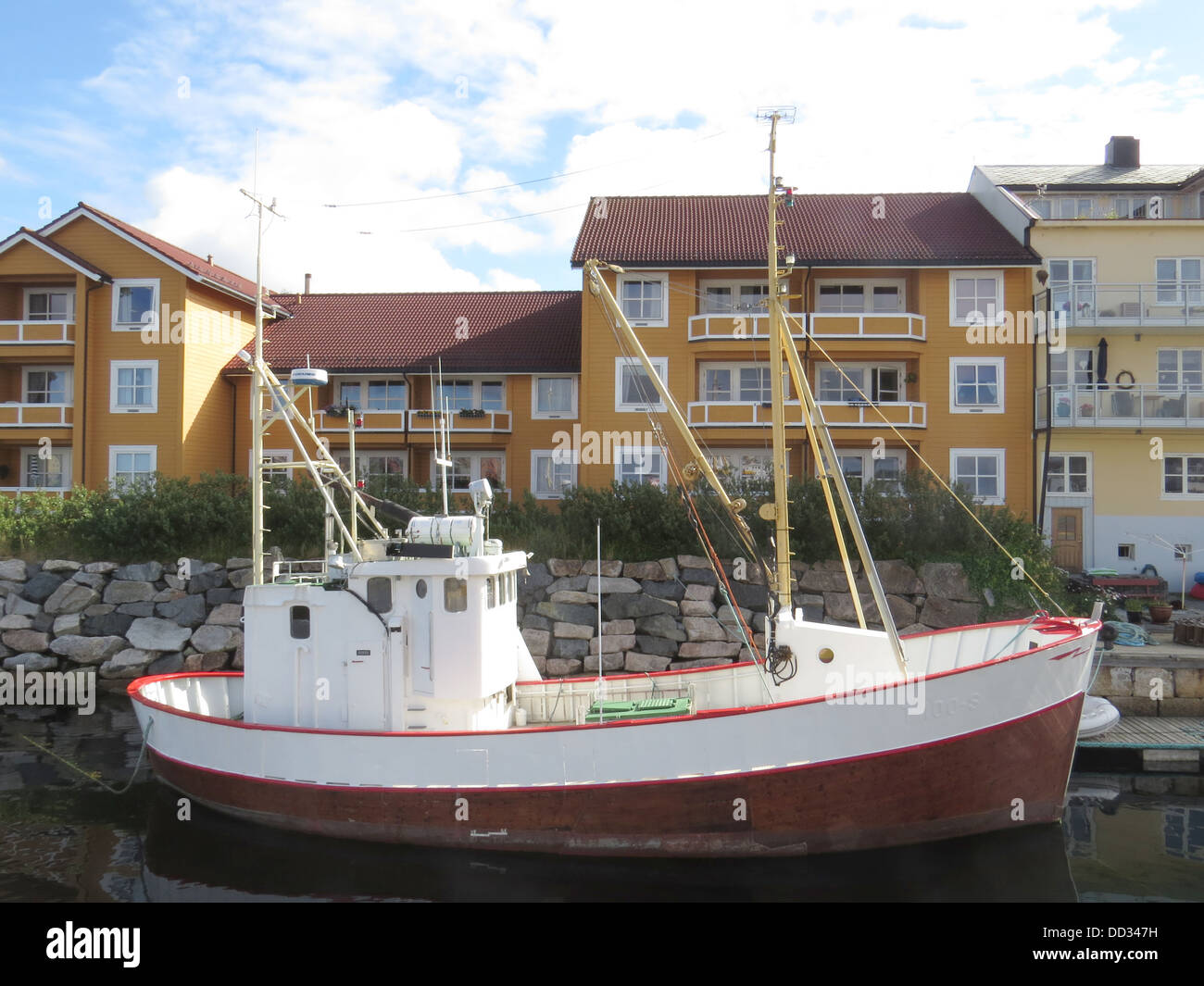 KRISTIANSUND Norway. Fishing boat besides harbour houses. Photo Tony ...