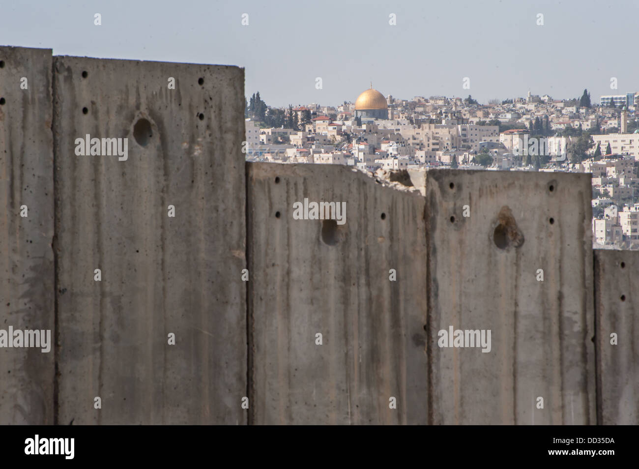 The Dome of the Rock is visible over the Israeli separation wall ...