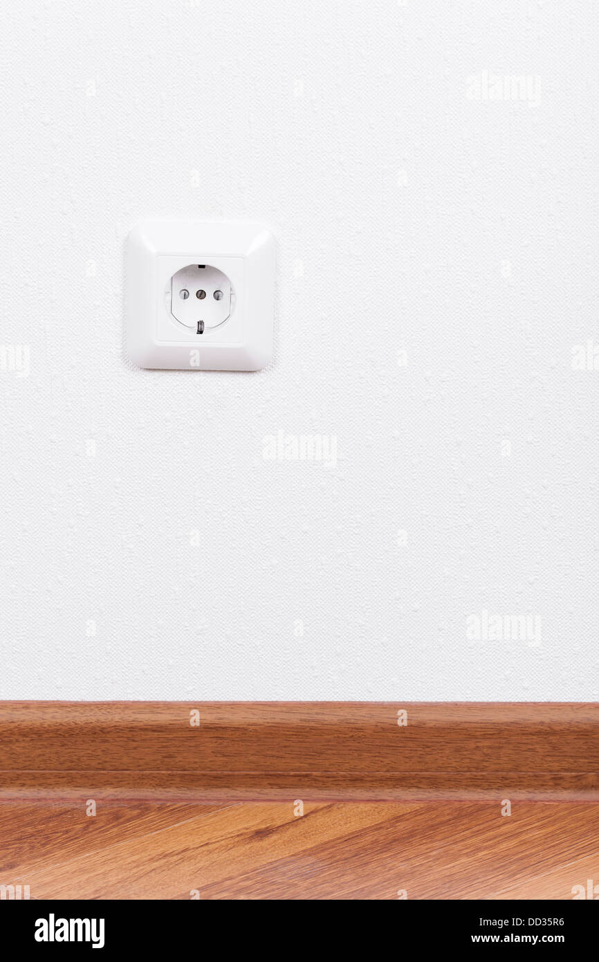 Electrical outlet on white wall, interior Stock Photo - Alamy