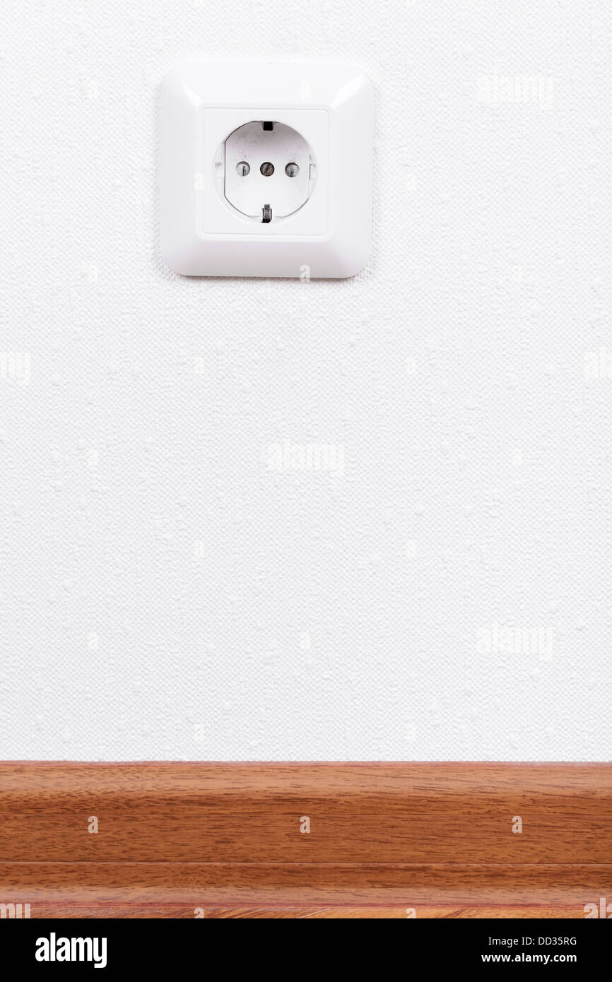 Electrical outlet on white wall, interior Stock Photo - Alamy