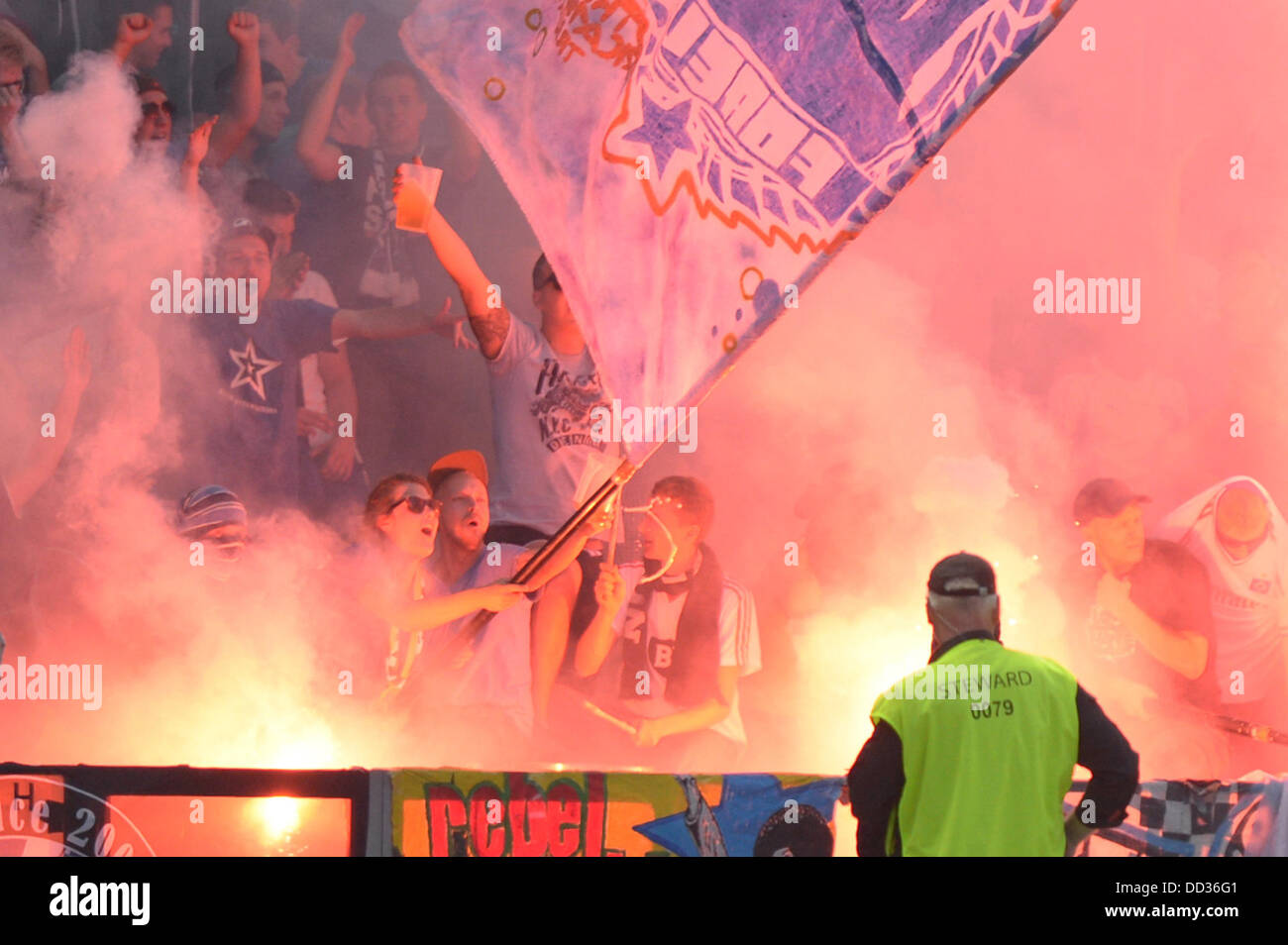 Berlin, Germany. 24th Aug, 2013. Fans of Hamburger SV light ...