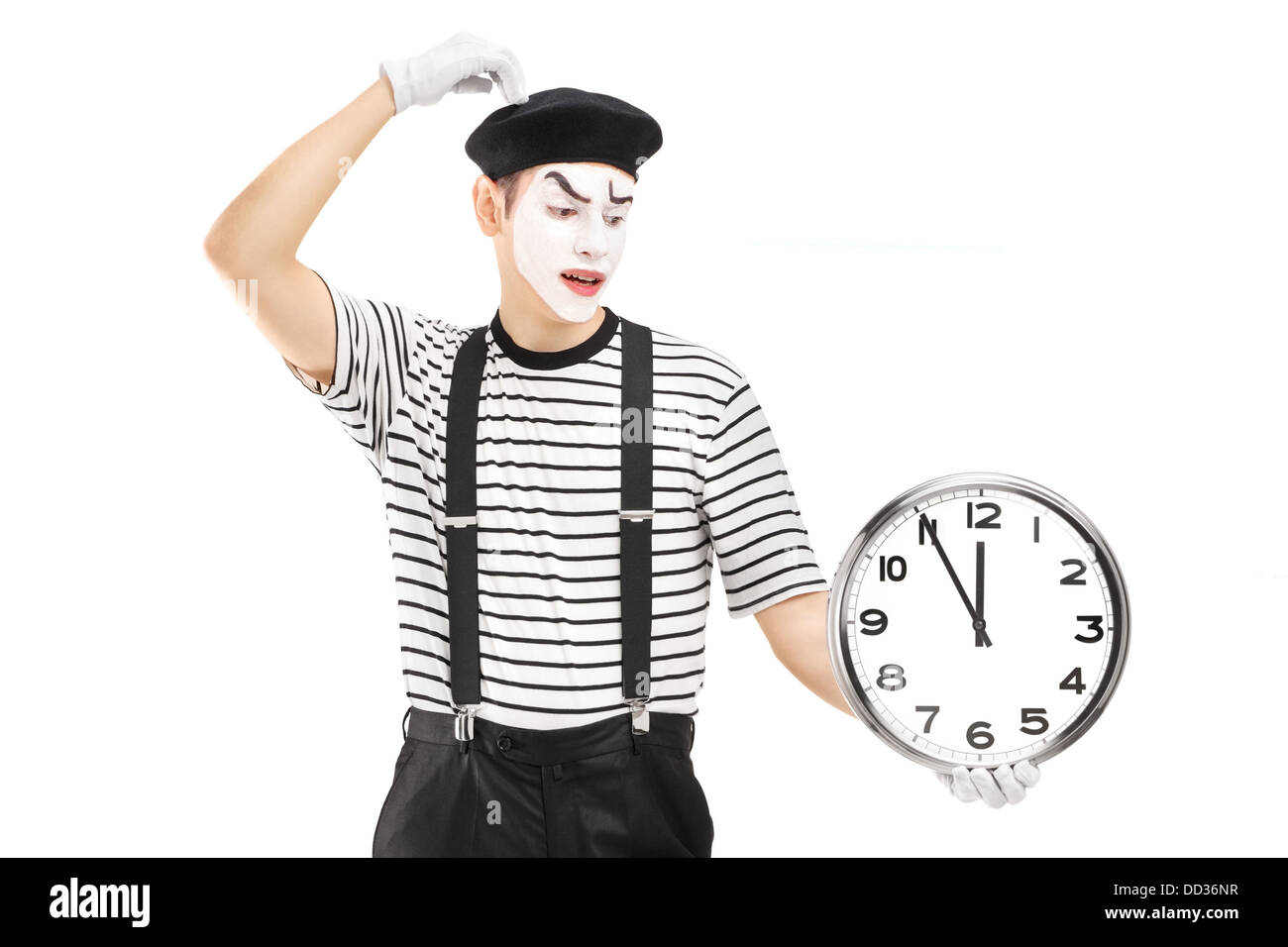 Mimic holding a clock and thinking Stock Photo - Alamy